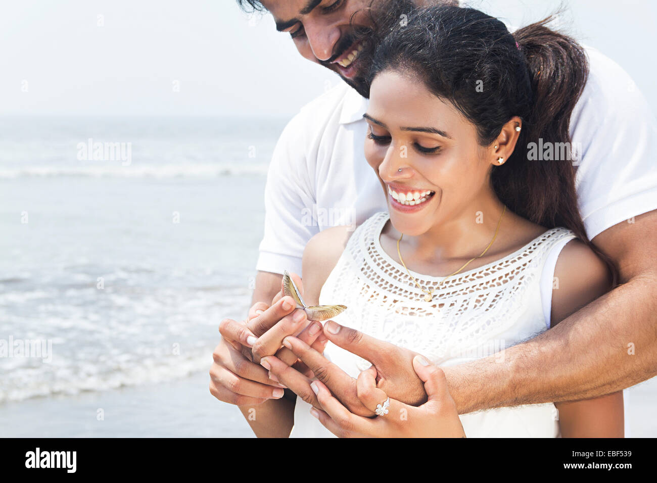 Young couple posed at beach hi-res stock photography and images - Alamy