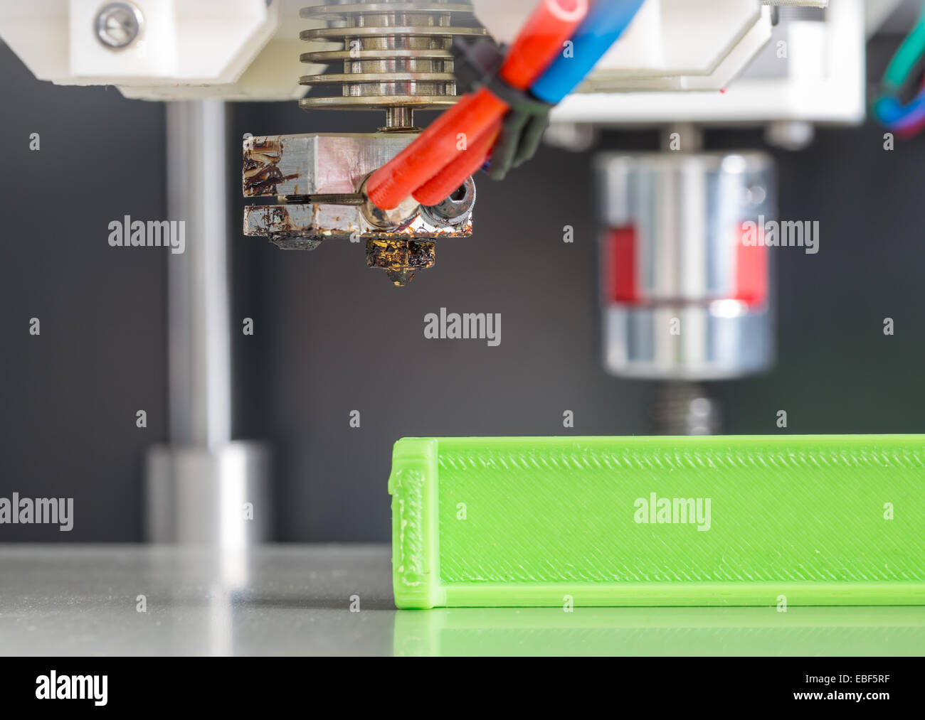 3d printer with bright green filament Stock Photo - Alamy
