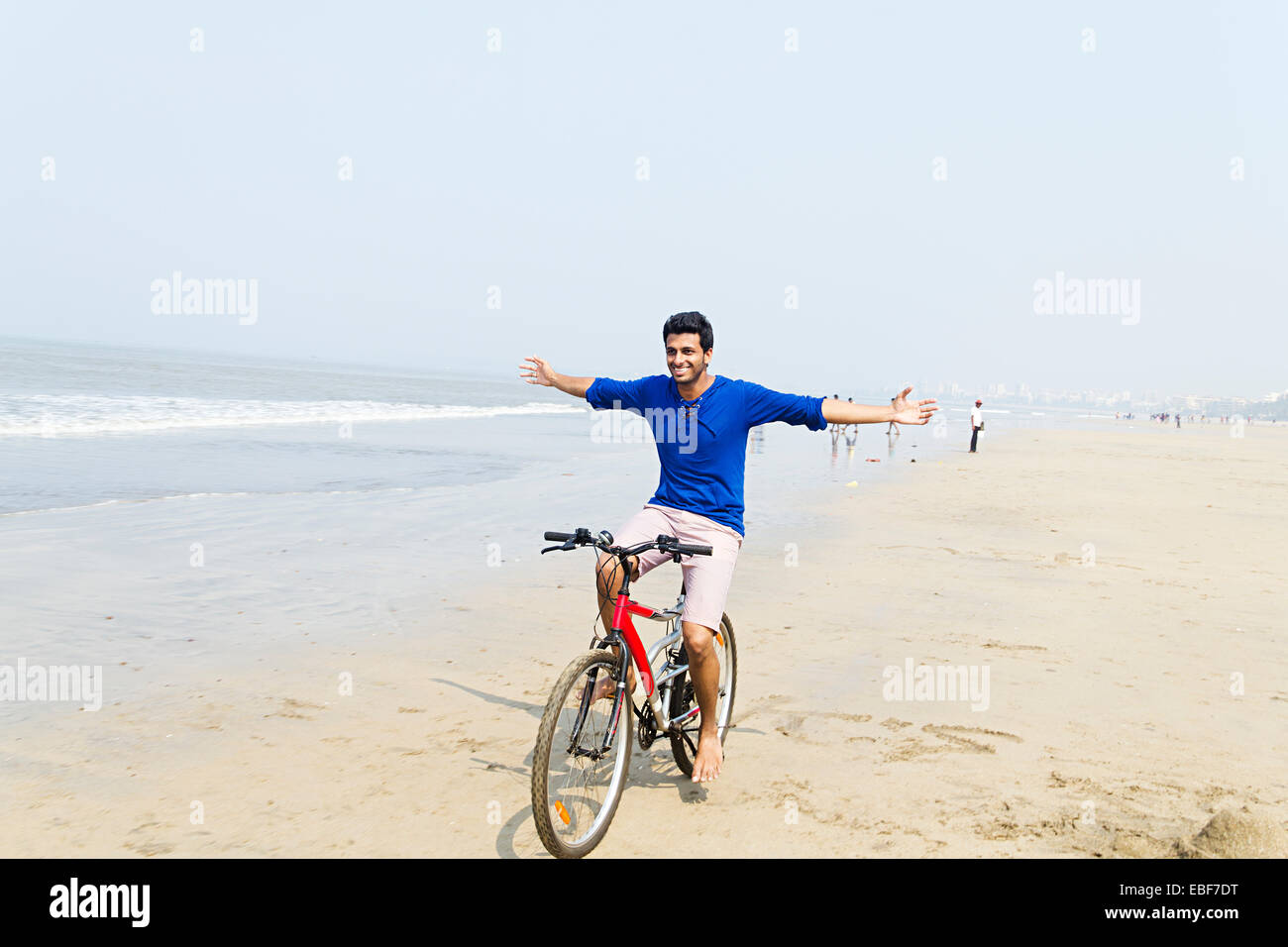 indian man beach Riding Cycle Stock Photo - Alamy