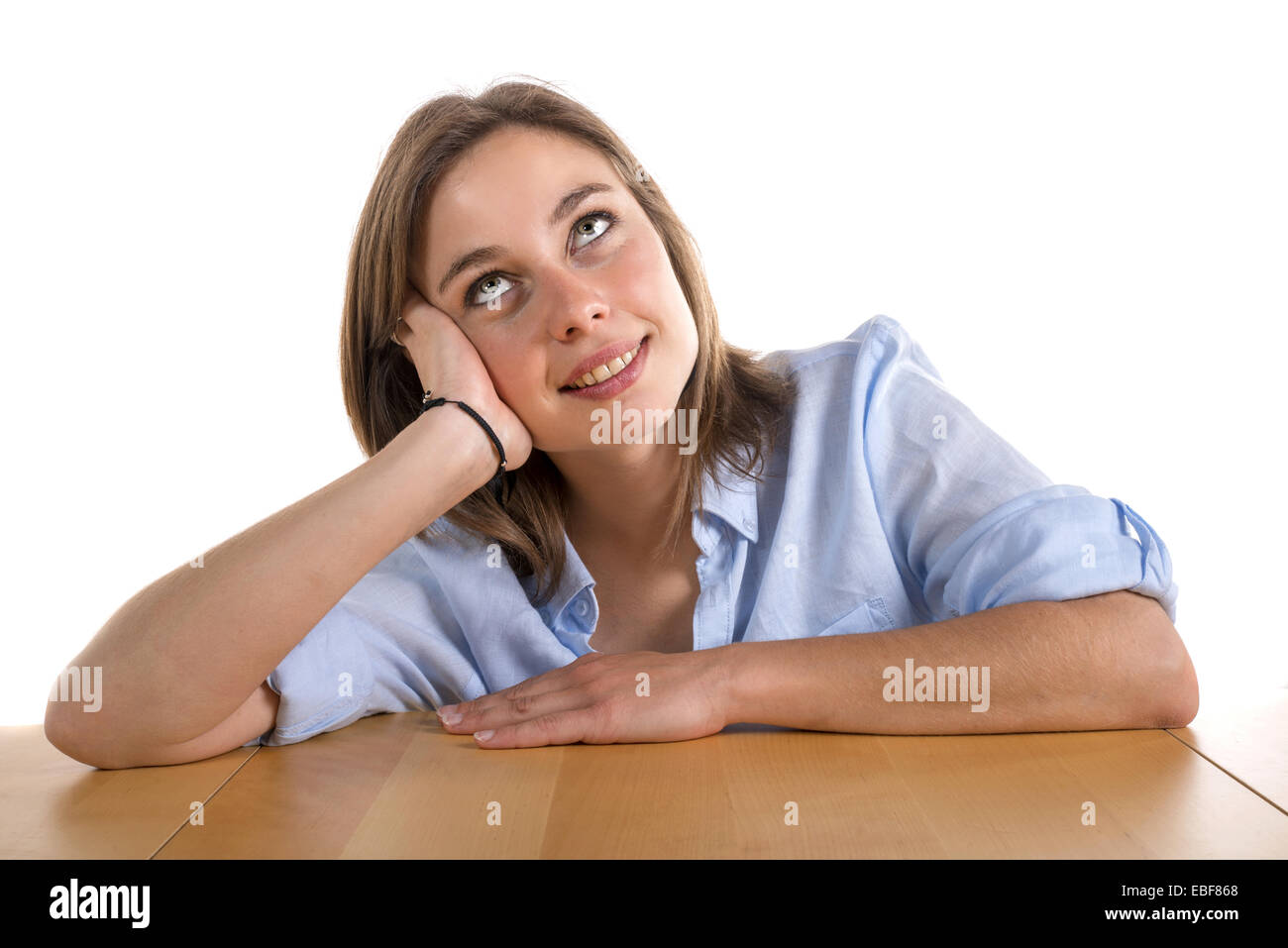 young woman lost in thought on the white background Stock Photo - Alamy
