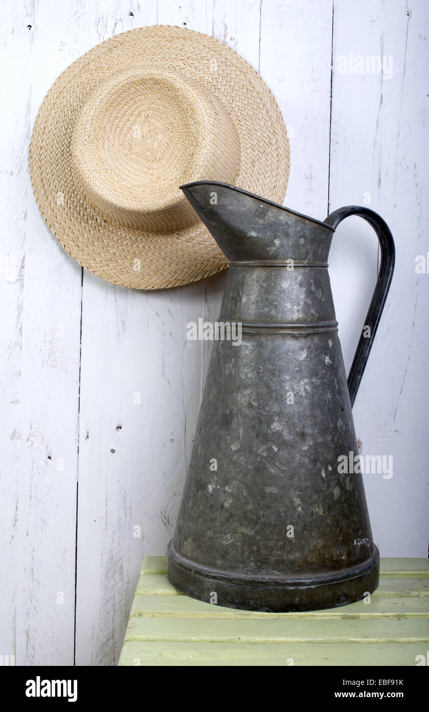 vintage pitcher on the white wall Stock Photo - Alamy