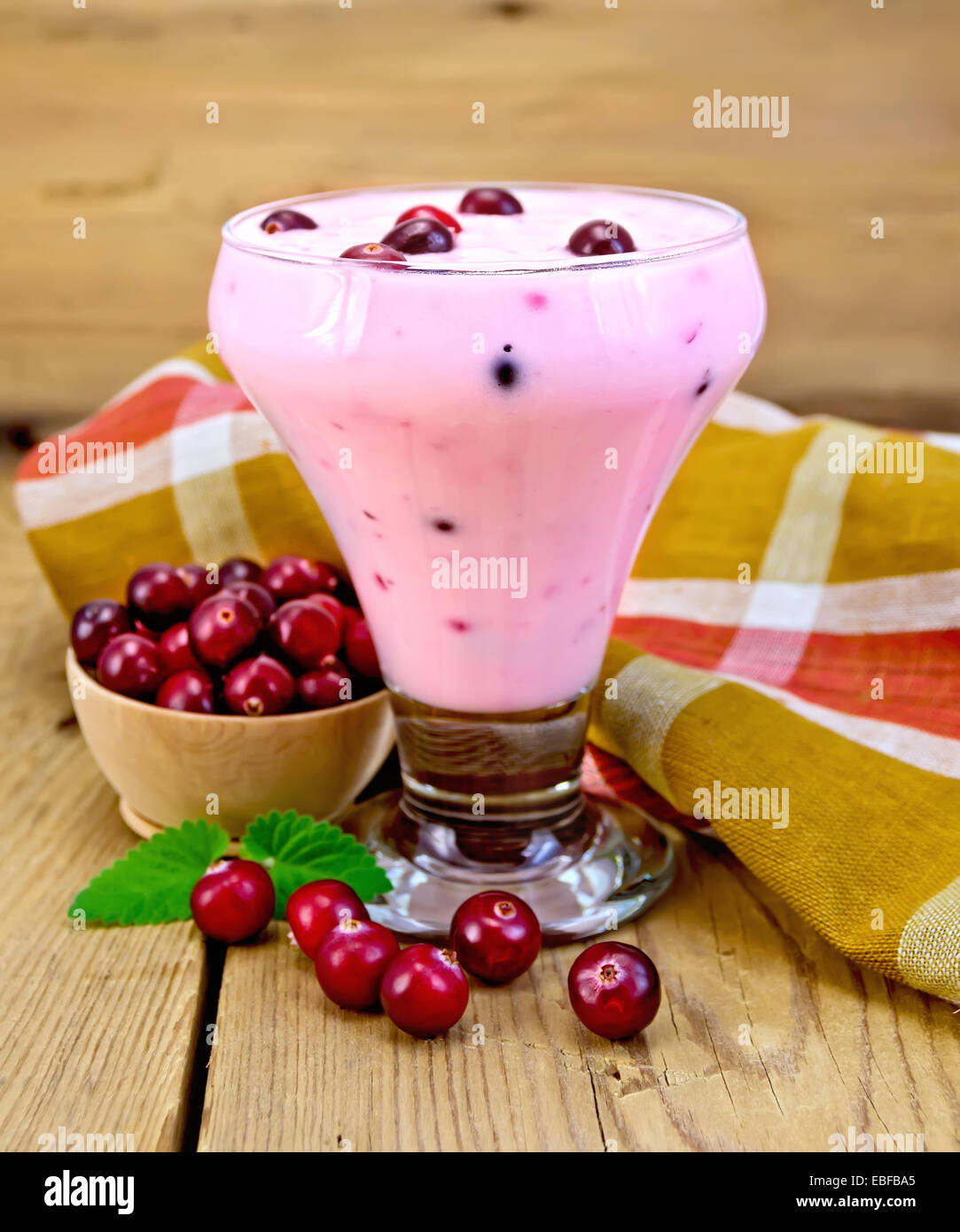 Yogurt thick with cranberries and mint on board Stock Photo - Alamy