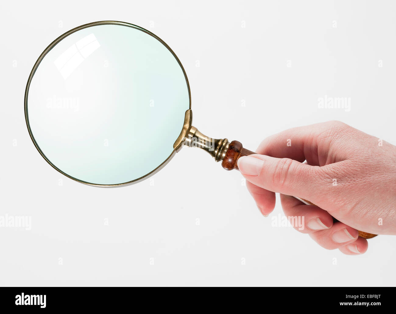 Woman hand holding magnifying glass isolated on white background Stock ...