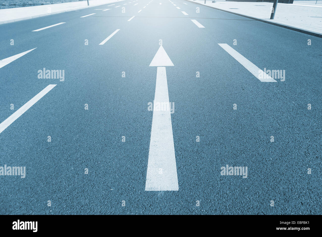 incalculable way, arrow on asphalt Stock Photo - Alamy