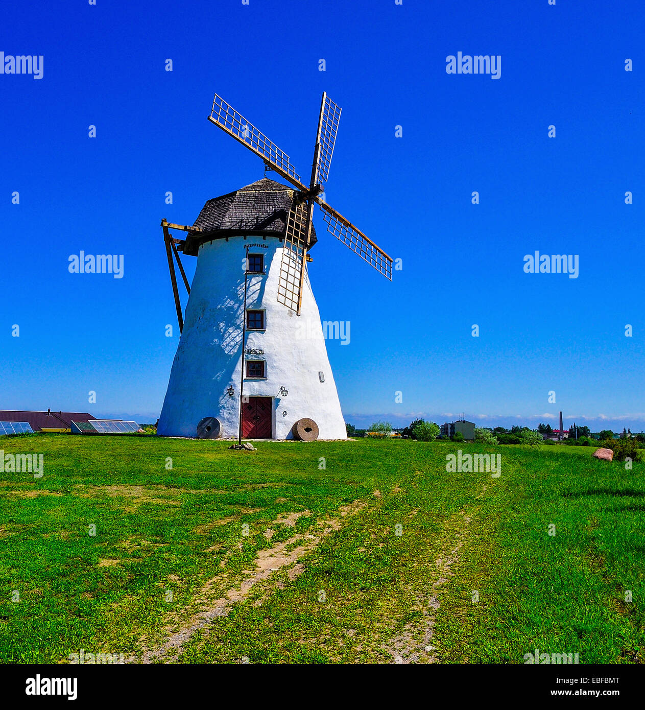 Windmill at the road Stock Photo - Alamy