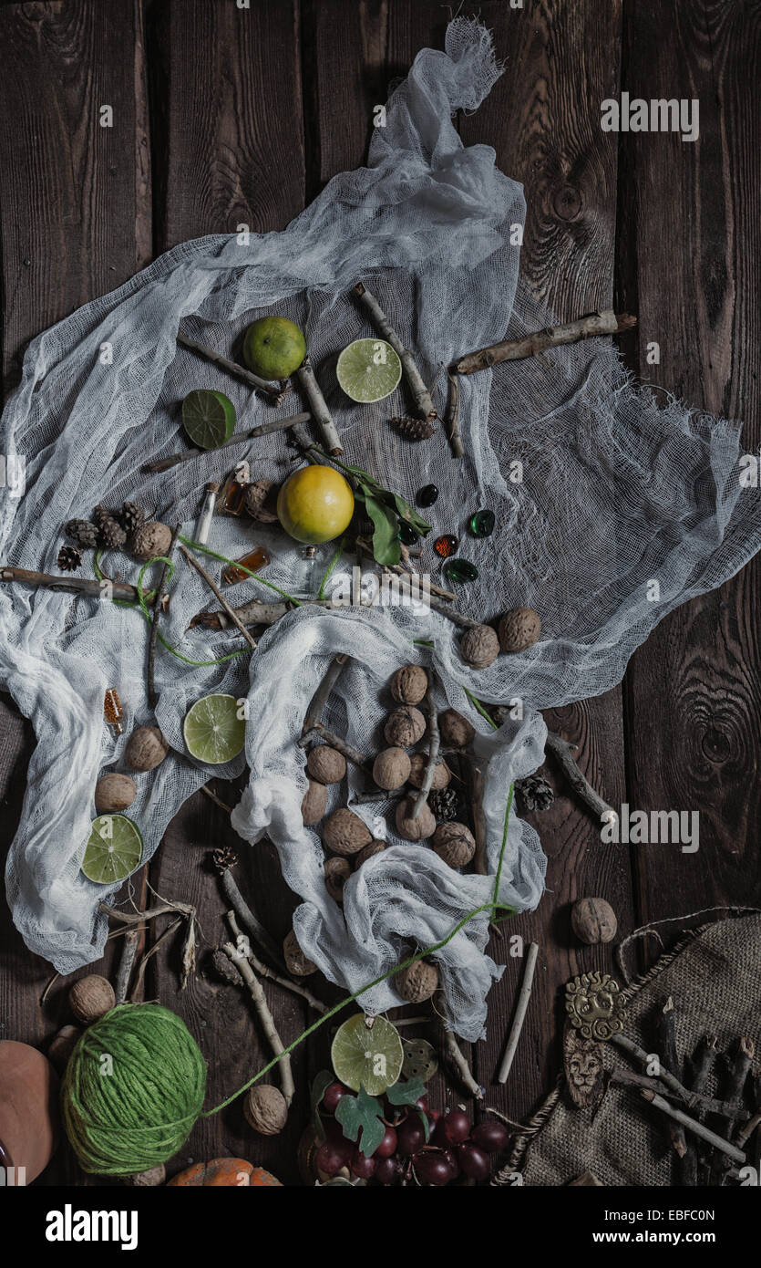 Still life of ingredients for making potions witch. Nuts, sticks ...