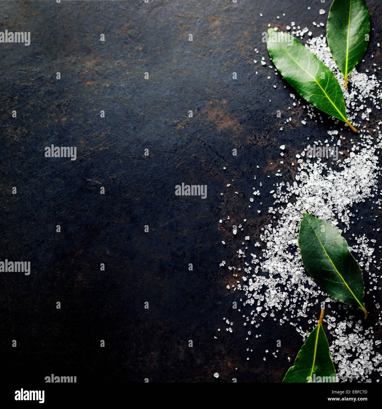 Bay Leaves with Sea Salt on dark background Stock Photo - Alamy