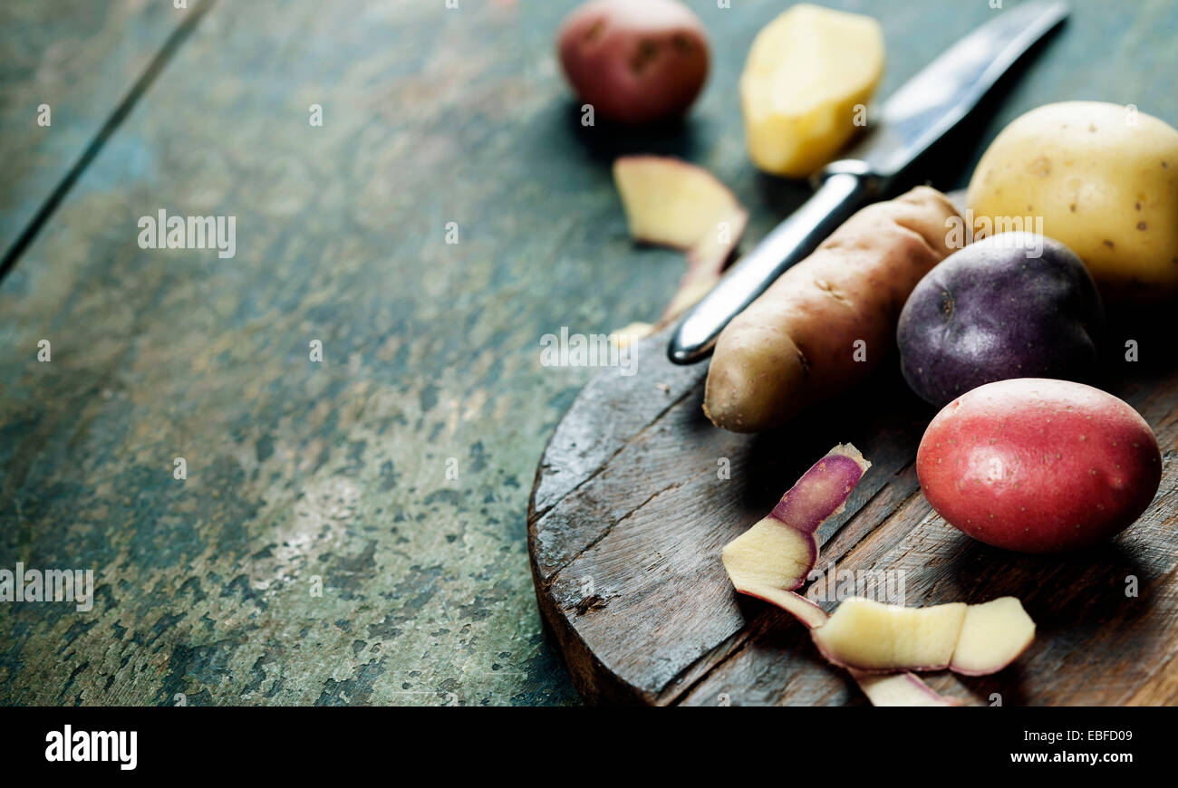 Raw colorful potatoes ready for cooking Stock Photo - Alamy