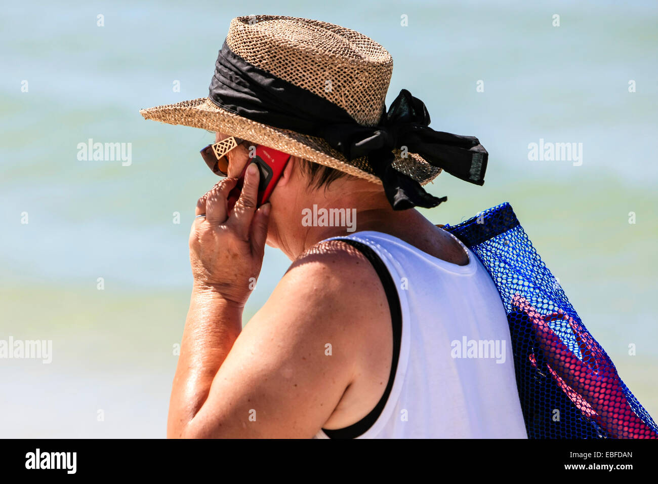 Conversation on beach hi-res stock photography and images - Alamy