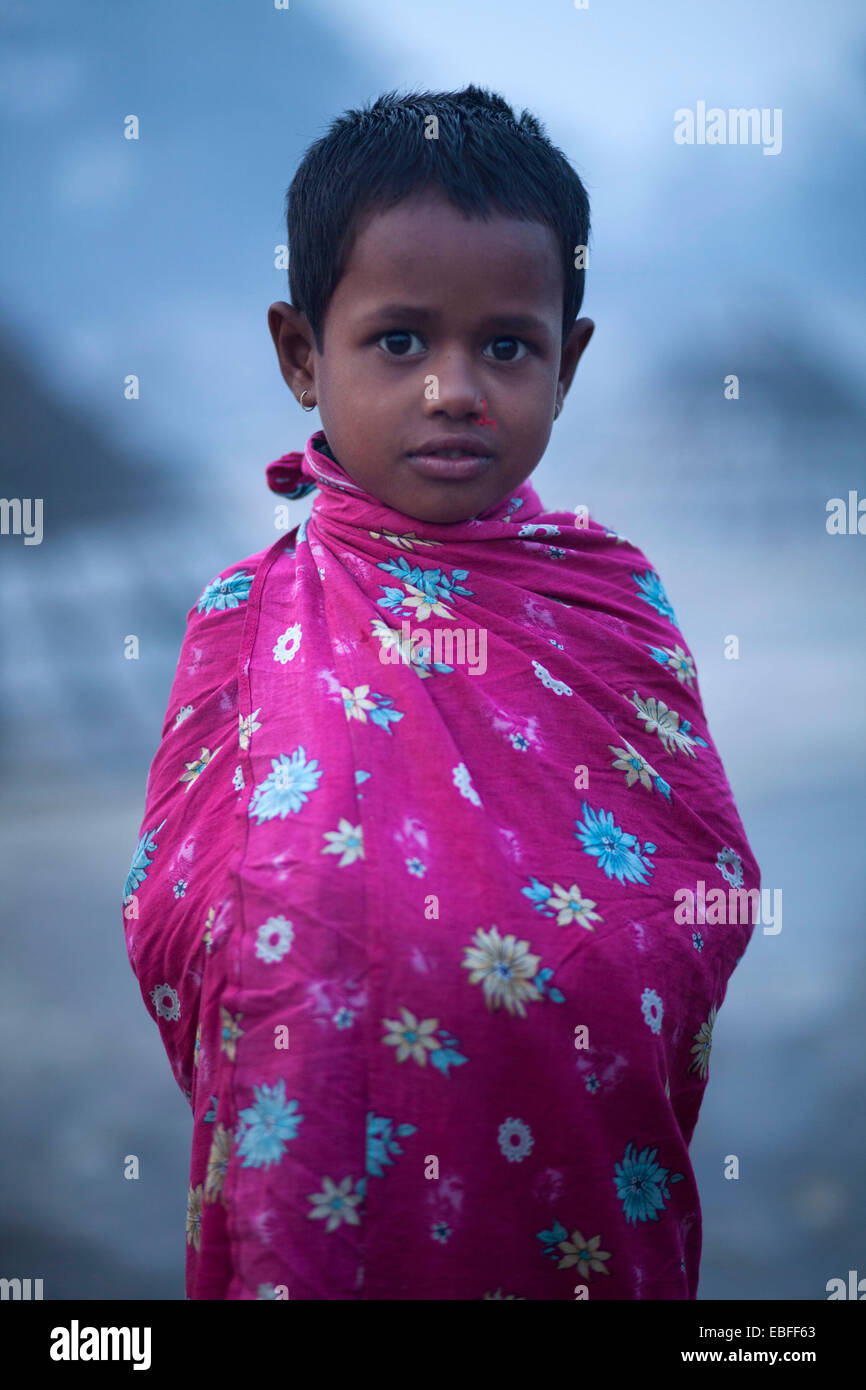 A street child wear a thin cloth to protect her from cold Stock Photo ...