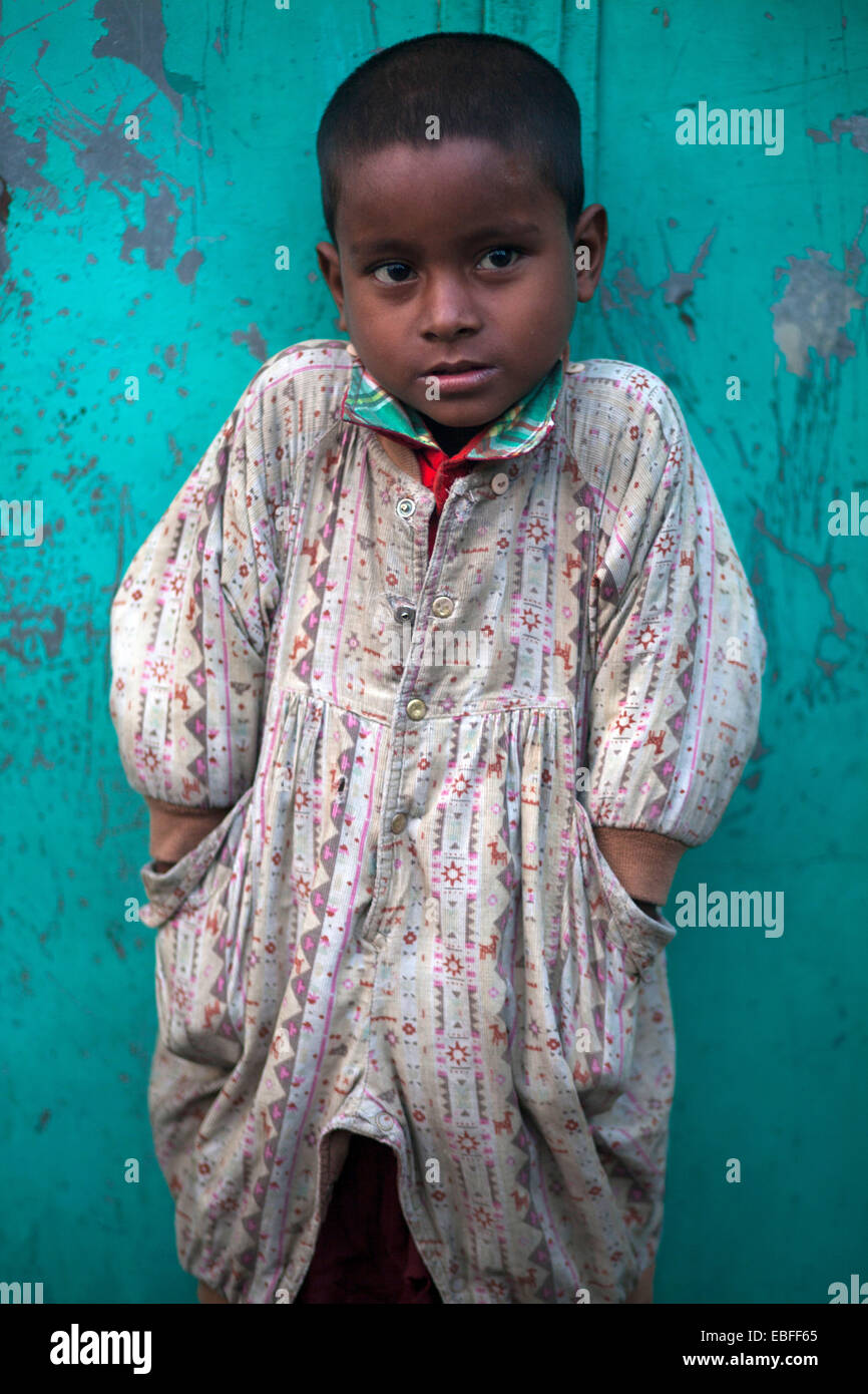 A street child wear a old cloth to protect her from cold Stock Photo ...