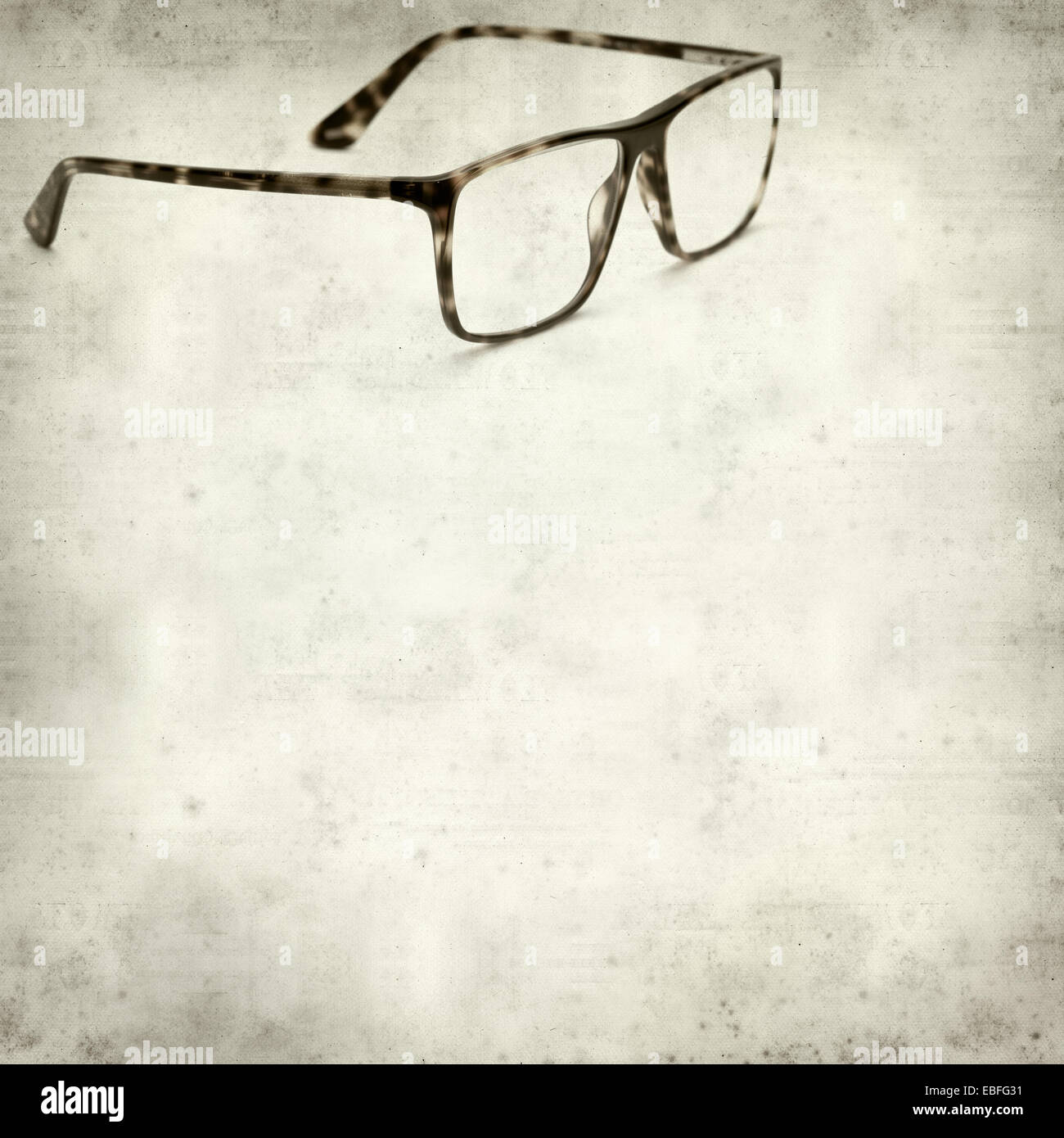 textured old paper background with reading glasses Stock Photo - Alamy
