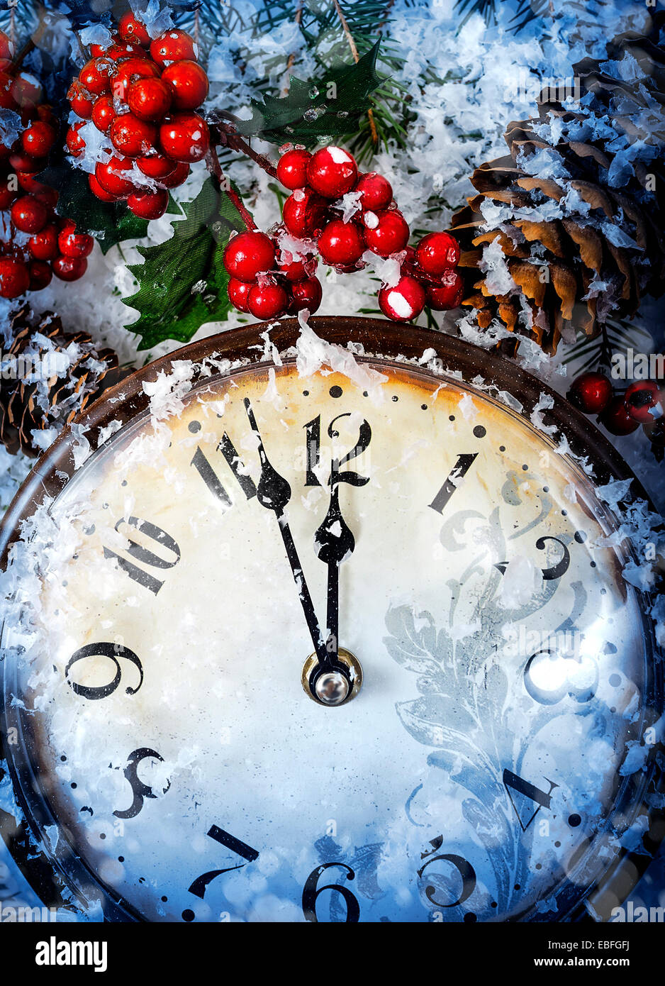 Christmas Eve and New Years at midnight. Clock covered with snow Stock ...