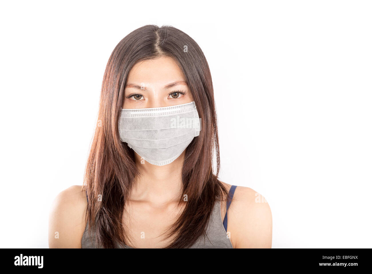 Chinese woman wearing surgical mask with white background Stock Photo ...