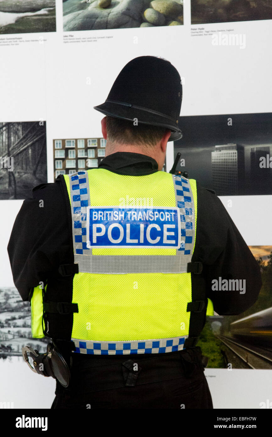 London UK. 30th November 2014. a British Transport police officer takes ...