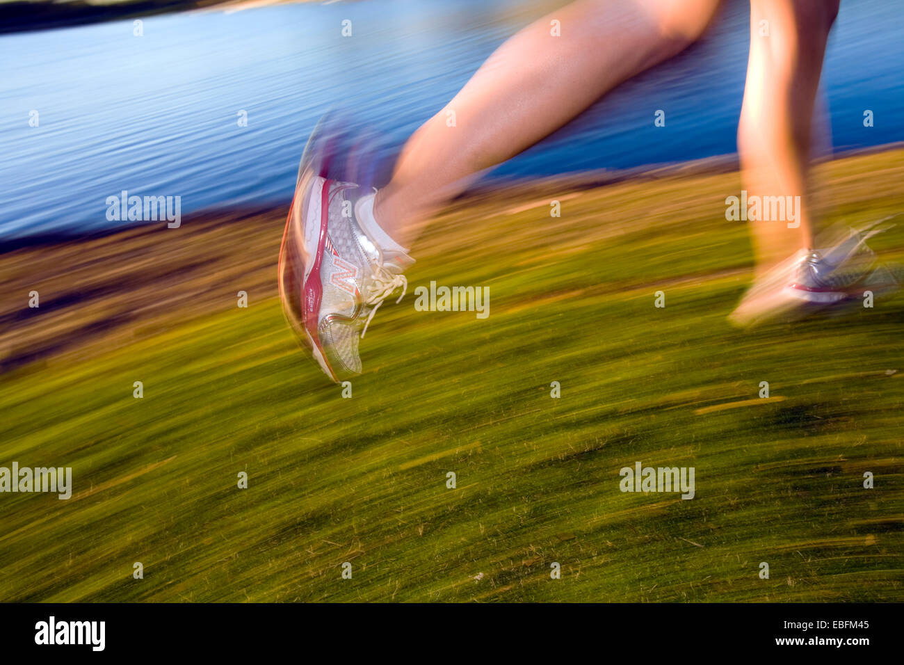 Close up of runner's foot and legs in motion Stock Photo - Alamy