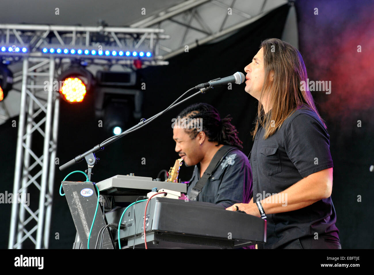 Michael Ruff singing and playing the keyboards on stage during the ...