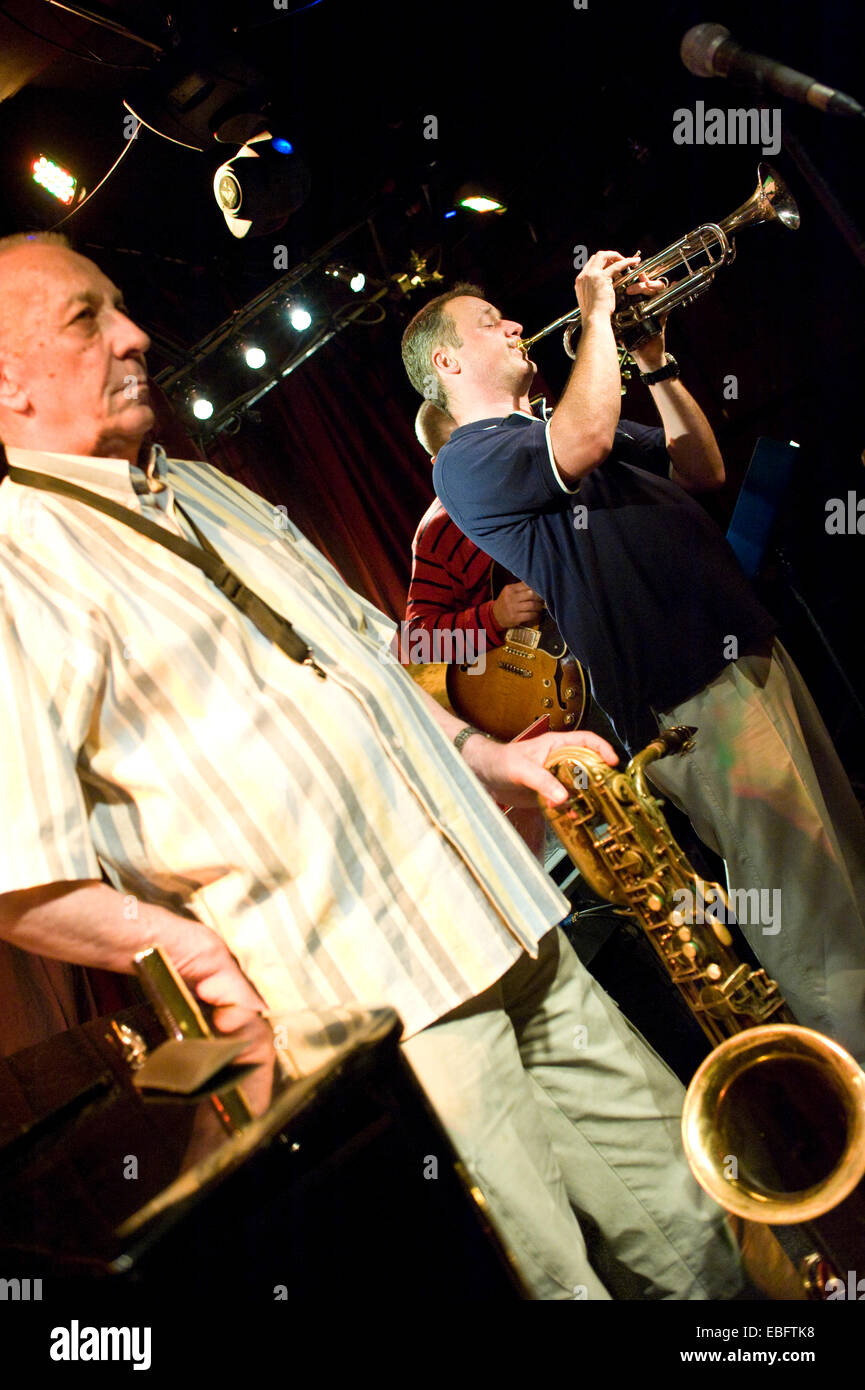 Waldemar Kurpinski on saxophone and Mark Shepherd on trumpet on stage ...