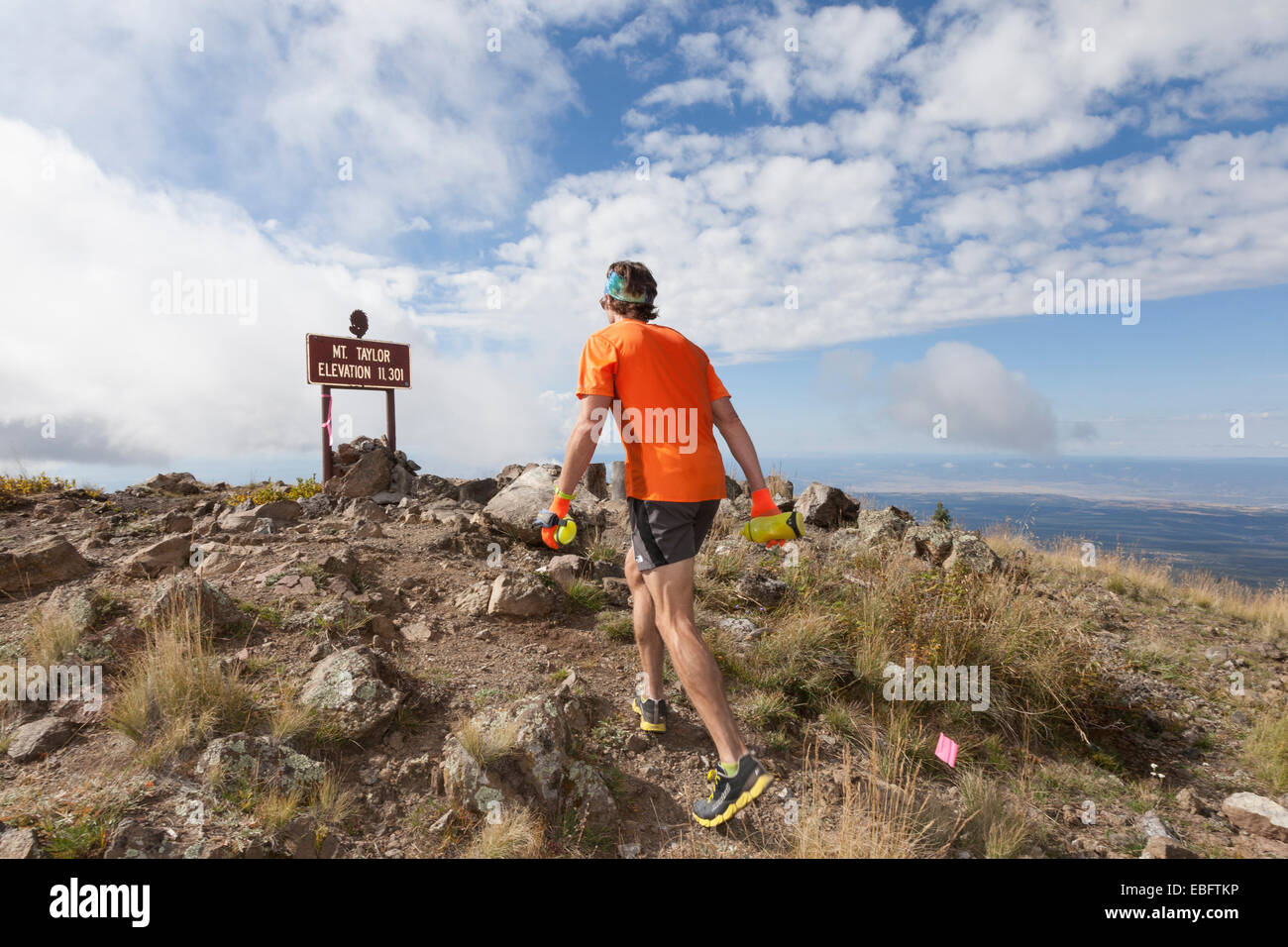 Runner approaching the summit during the Mt Taylor 50k on September 27 ...