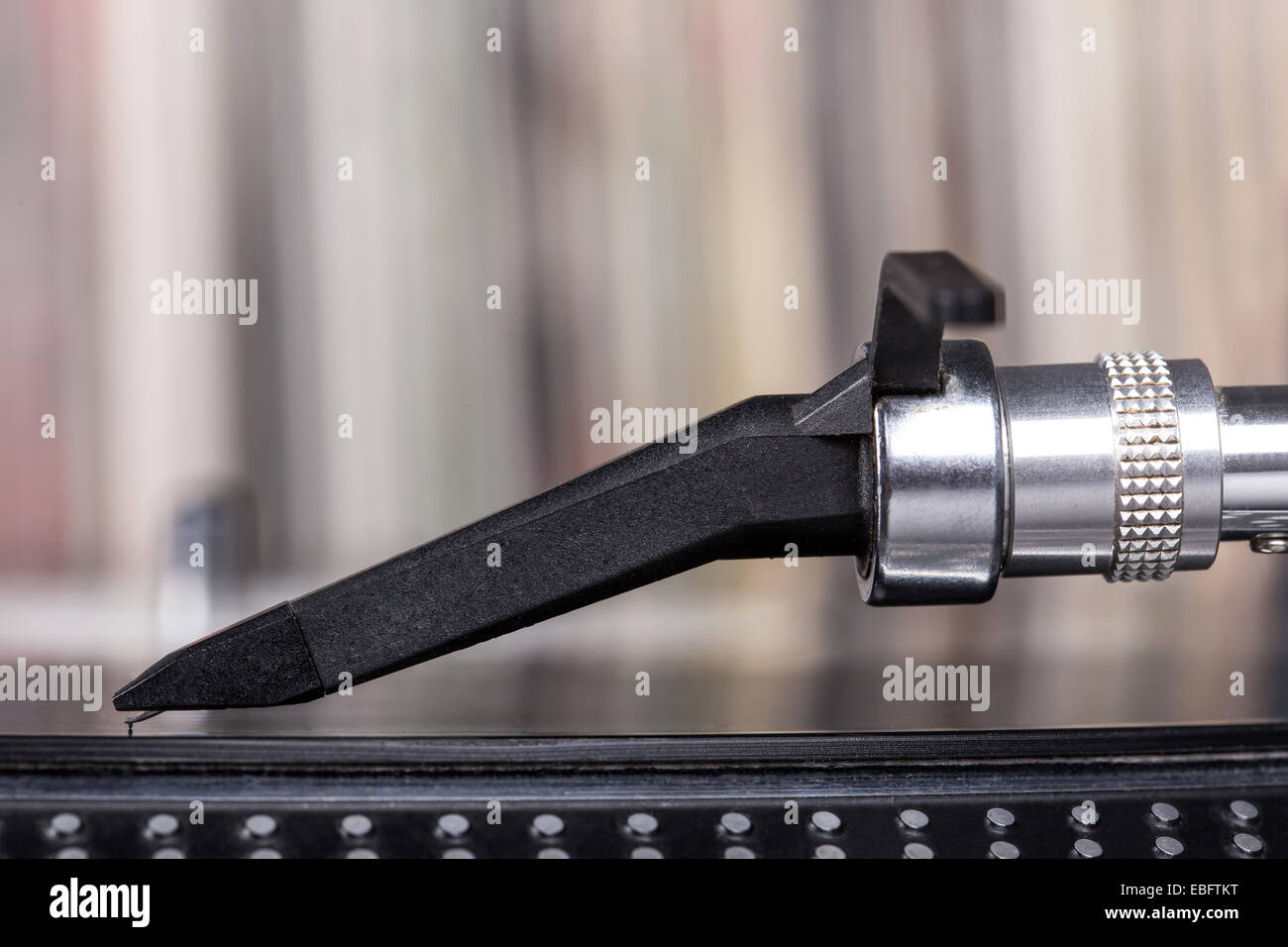 Dj needle stylus on spinning record, vinyl background Stock Photo - Alamy