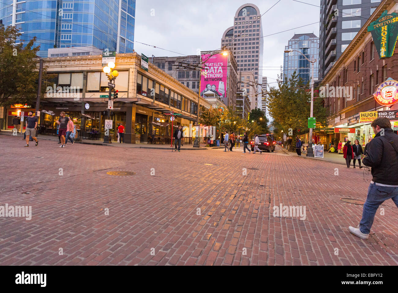 People walking on the street / cross road in the center of Seattle in ...