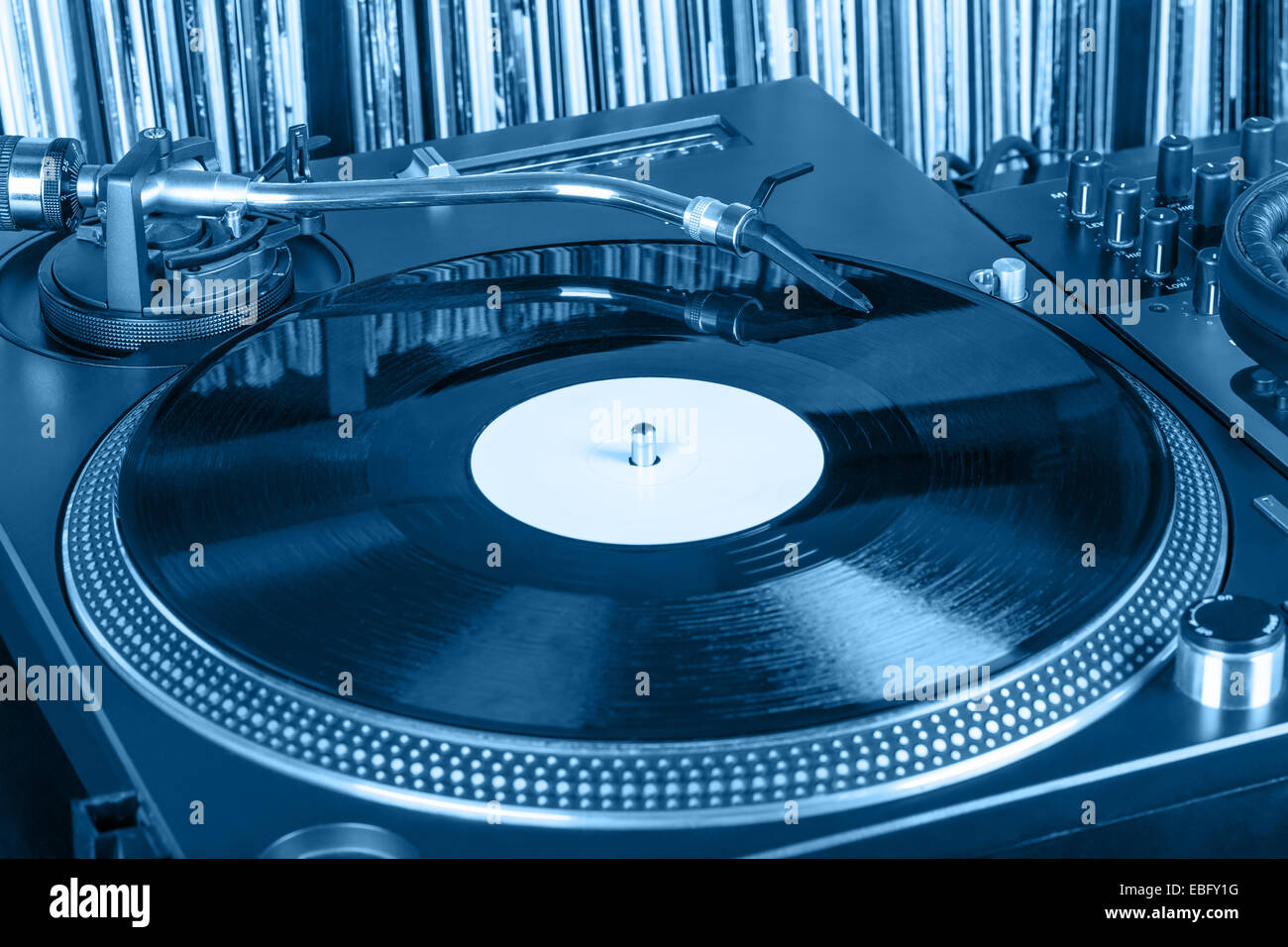 Dj needle stylus on spinning record, vinyl background Stock Photo - Alamy