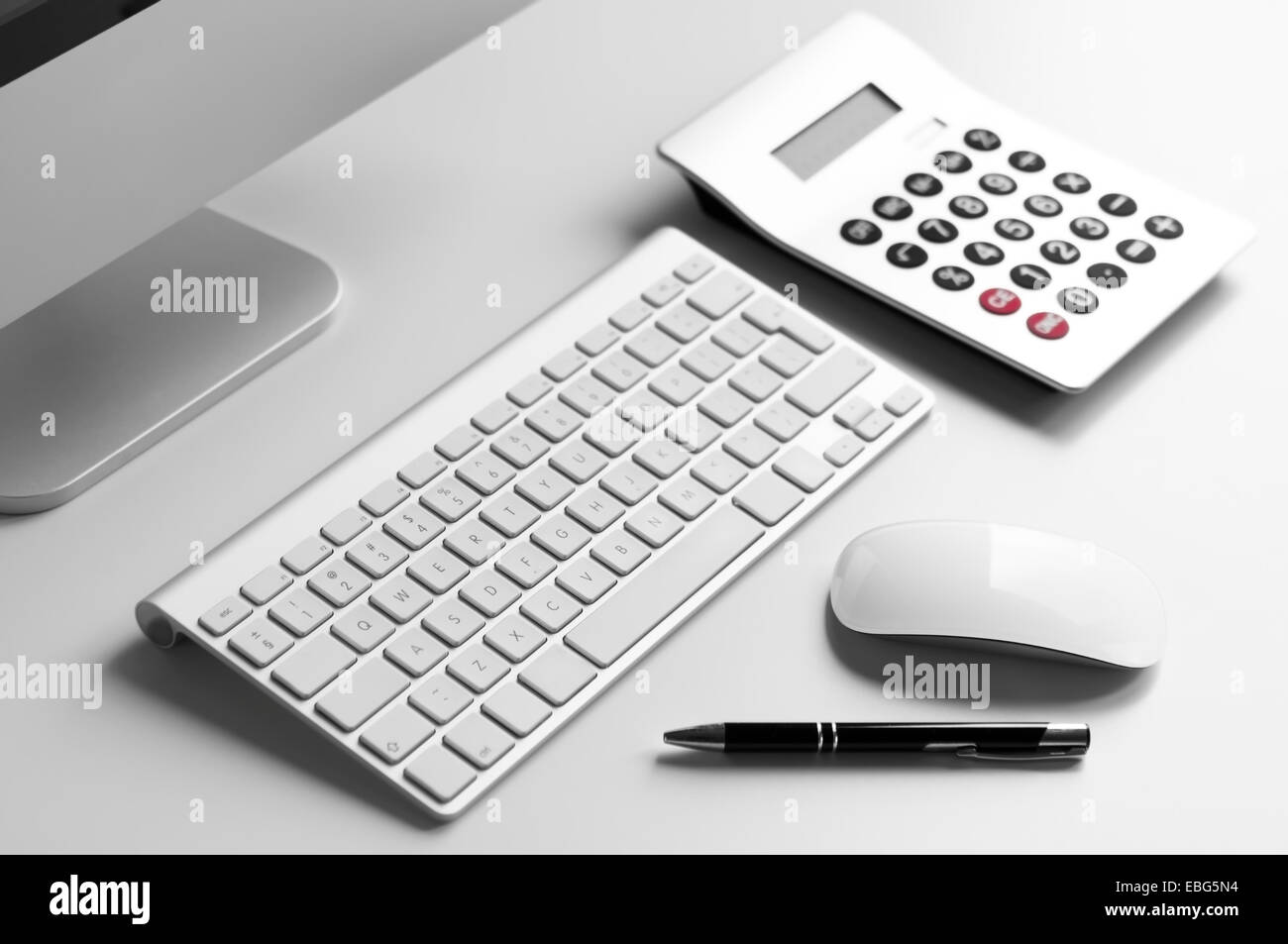 Desk with computer keyboard, calculator and ball point Stock Photo - Alamy