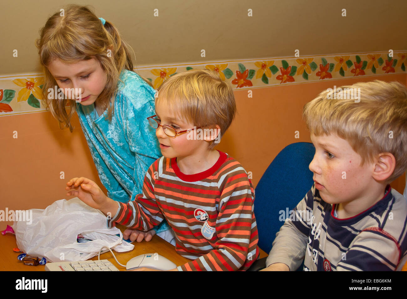 Group of a small children sitting in front of computer Stock Photo - Alamy