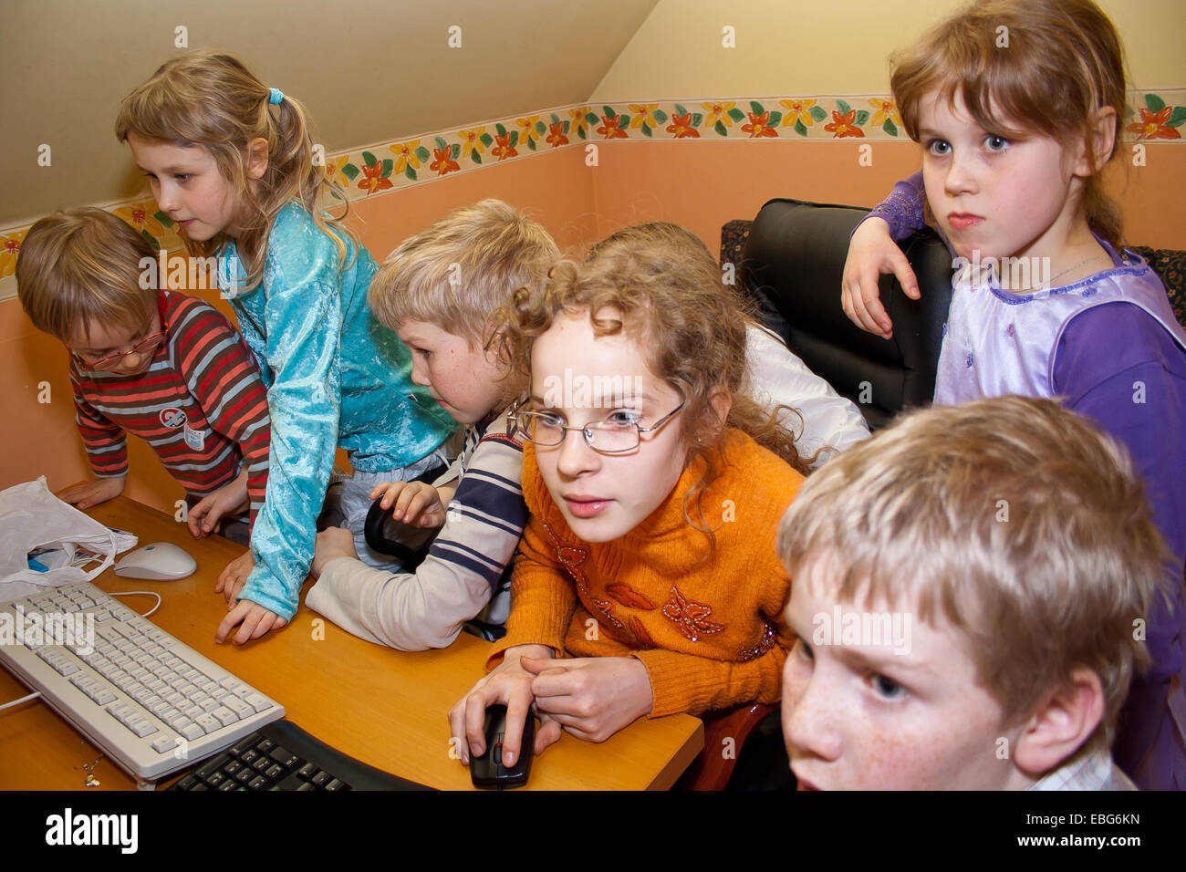 Group of a small children sitting in front of computer Stock Photo - Alamy
