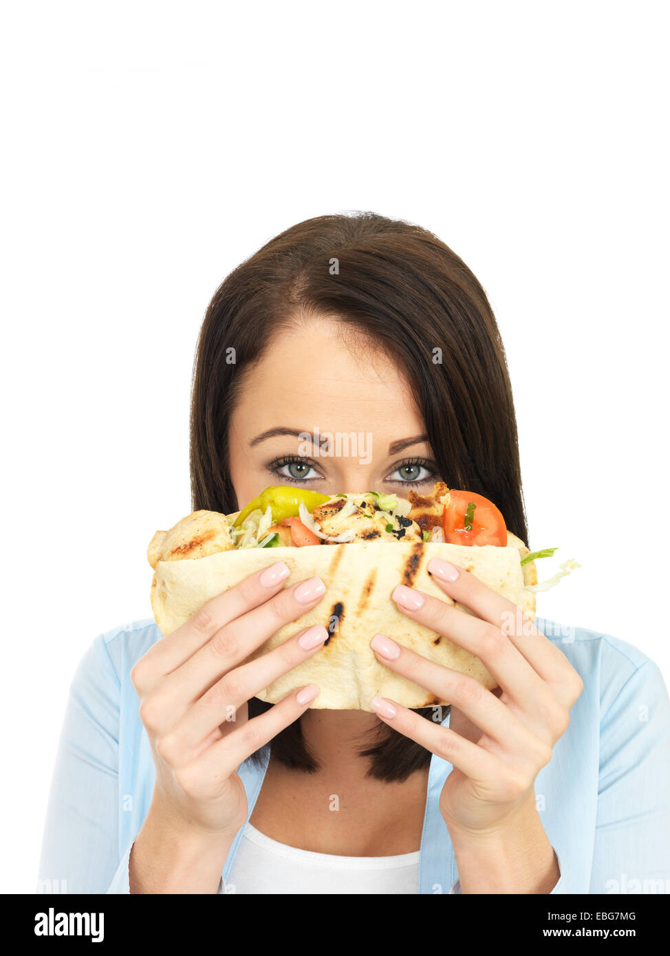 Attractive Young Woman Eating Chicken Kebab with Salad Stock Photo - Alamy