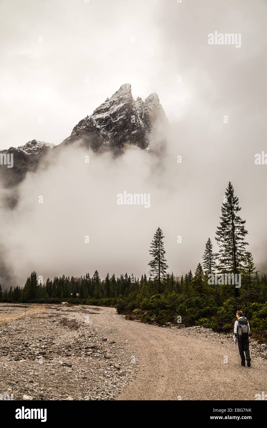 a mountain between the fog in the italian alps Stock Photo - Alamy