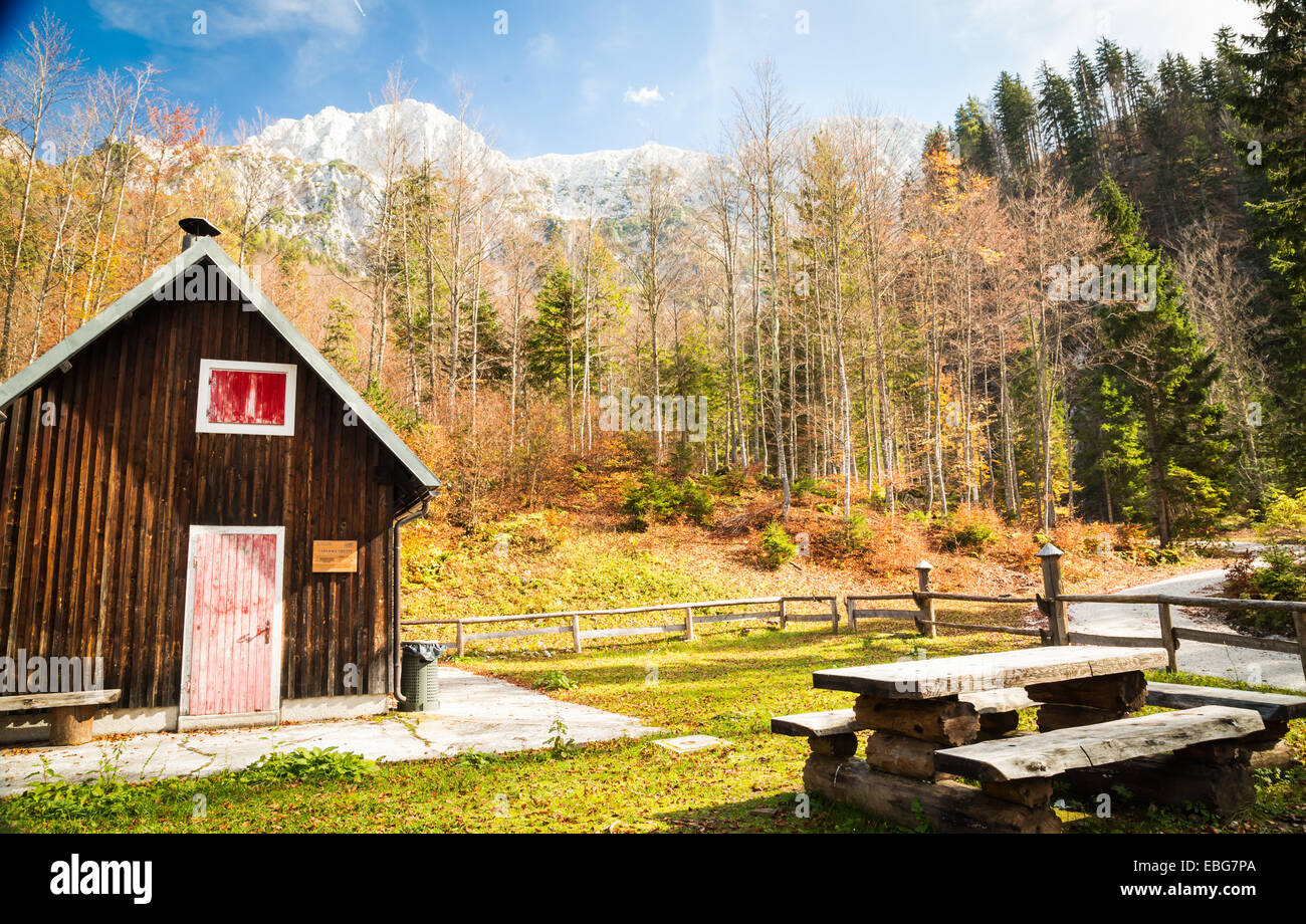 Alpine hut with a bench in the italian alps Stock Photo - Alamy