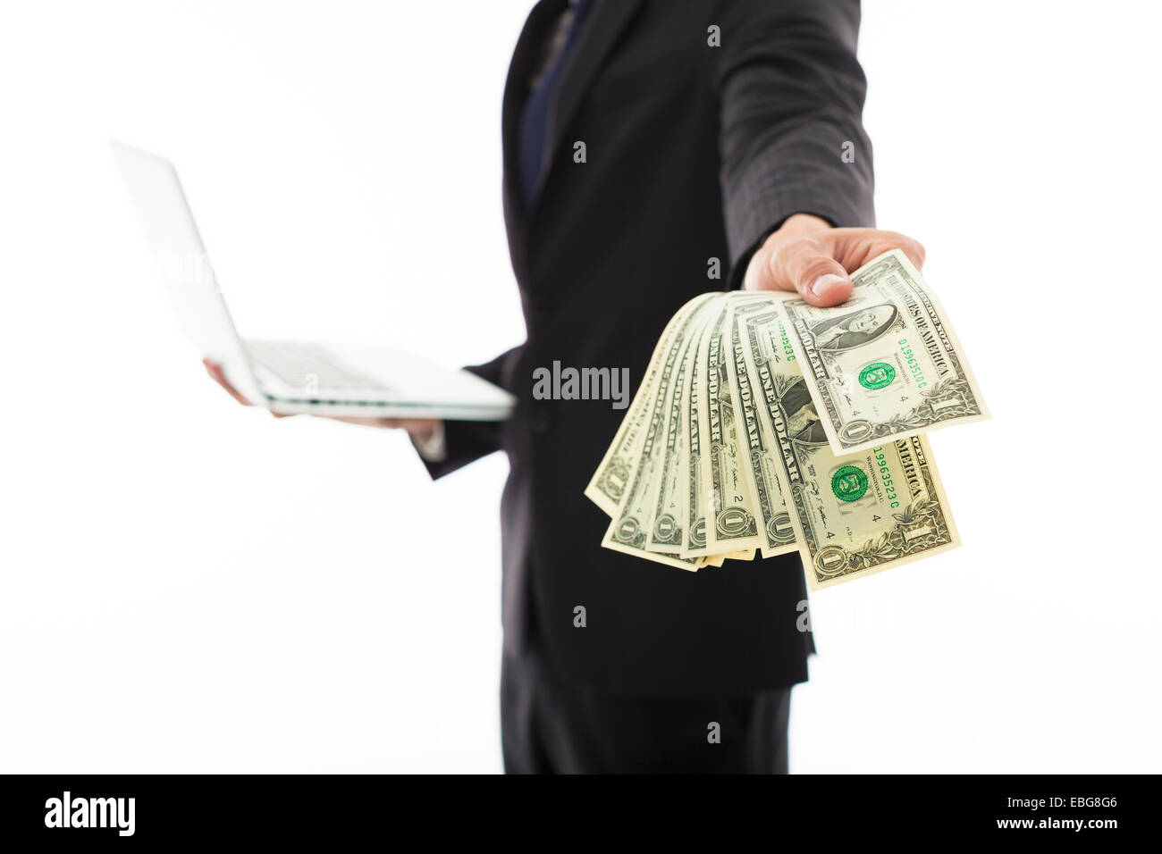 businessman showing laptop and money for online trade concept Stock ...