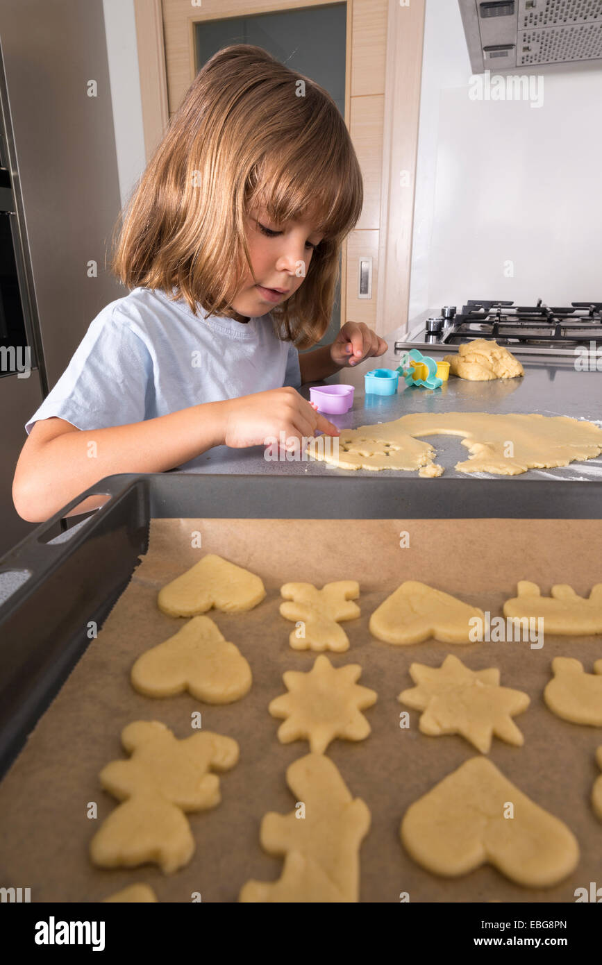 Little girl making cookie dough at home Stock Photo - Alamy