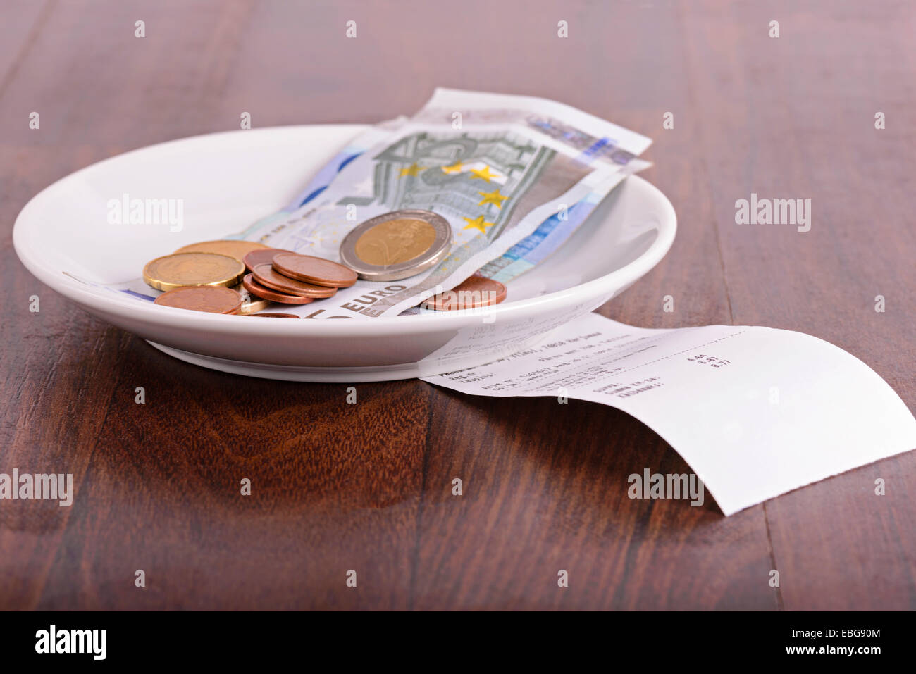 Tip on a restaurant table Stock Photo - Alamy