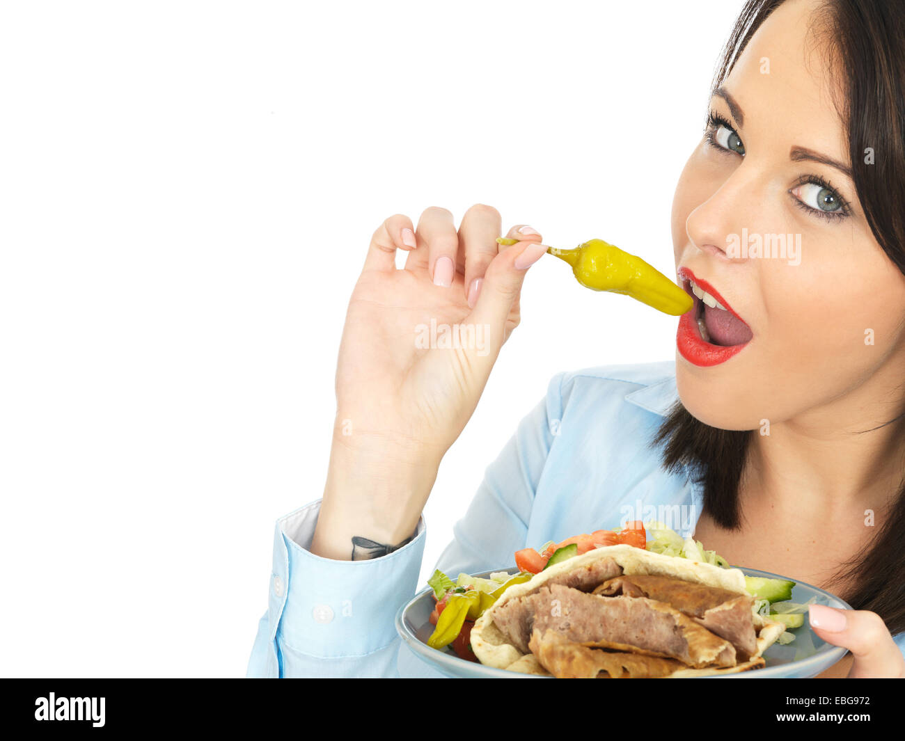 Attractive Young Woman Eating Donner Kebab with Salad Stock Photo - Alamy