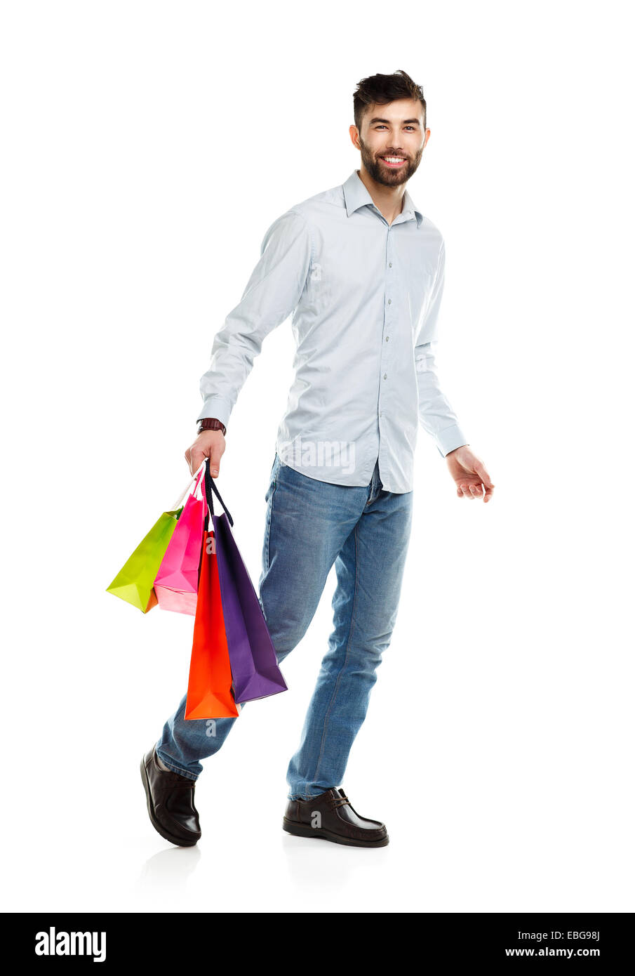 Handsome man holding shopping bags. Christmas and holidays concept ...