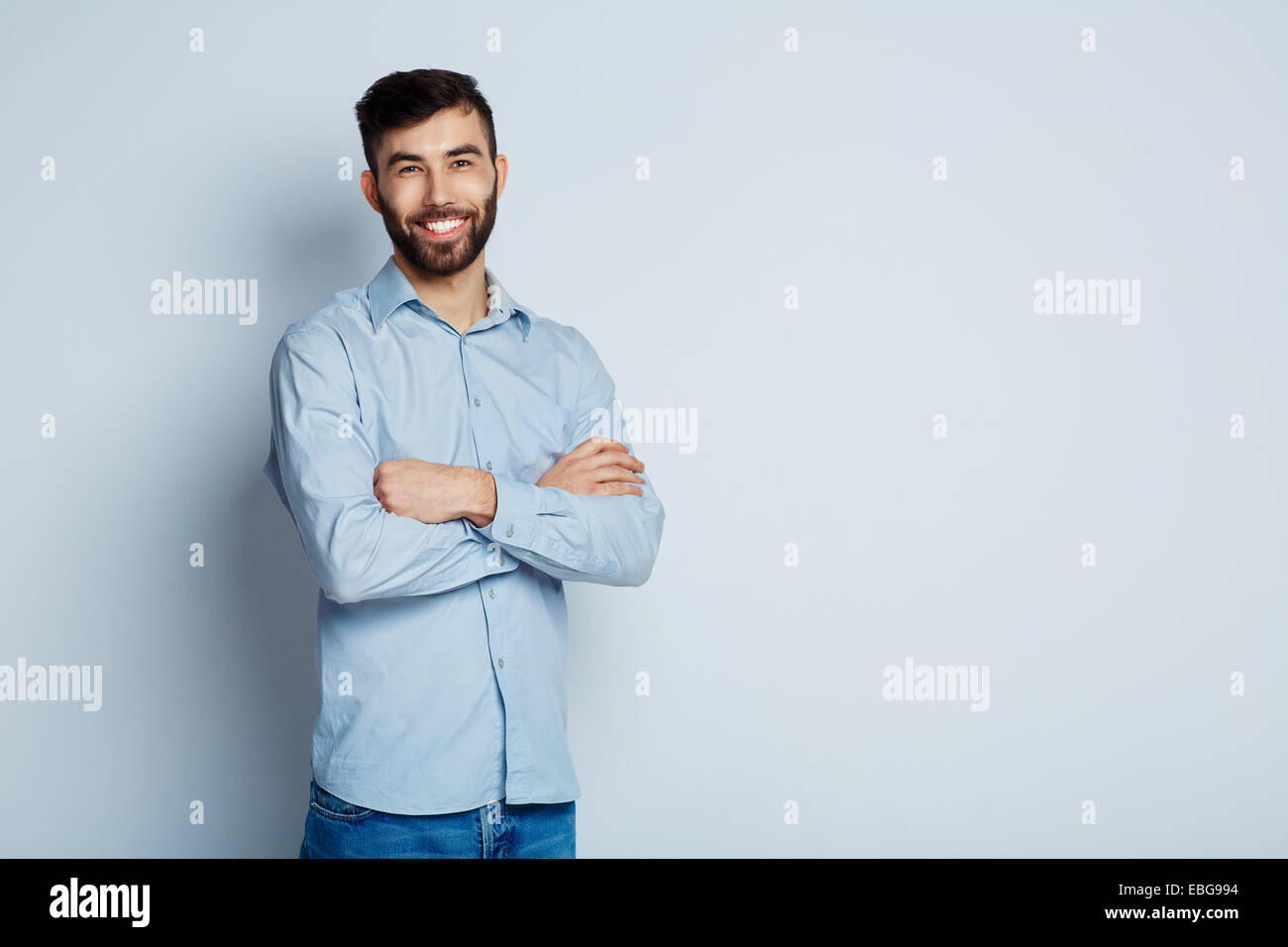 A young bearded man smiling Stock Photo - Alamy