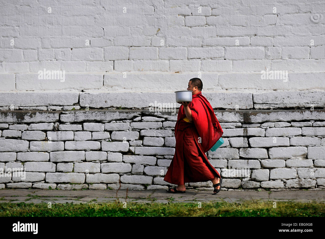 Buddhist monk walking through monastery hi-res stock photography and ...