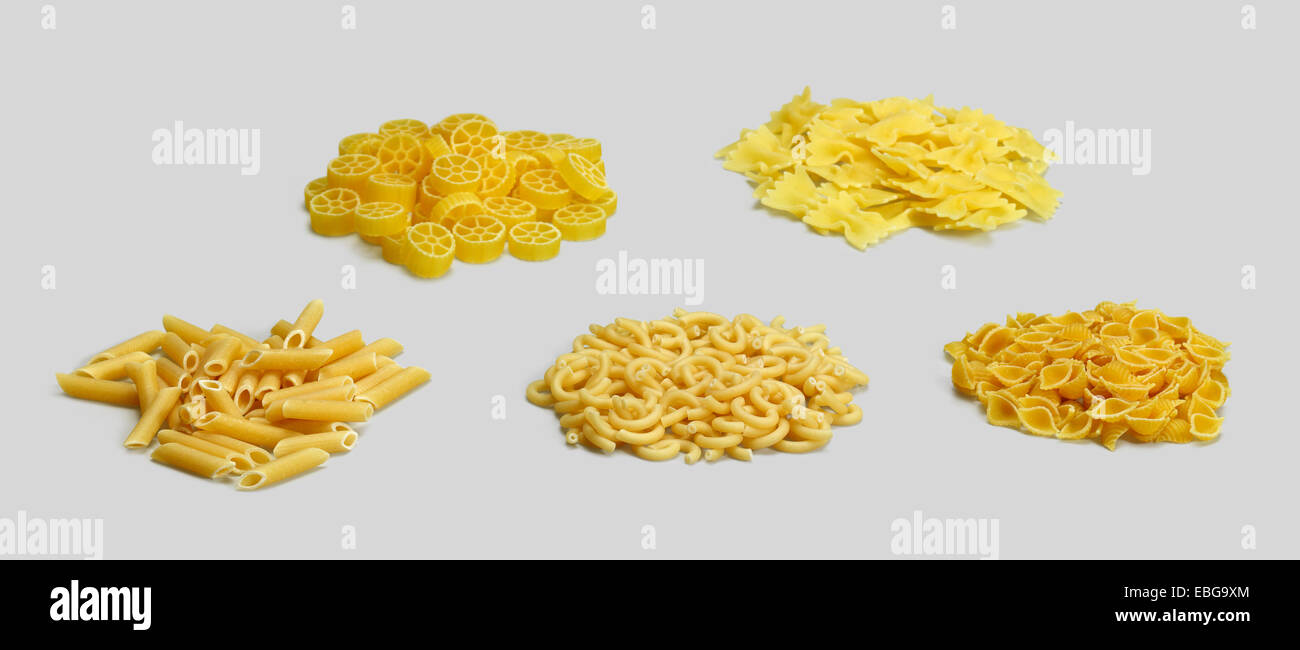 small piles with different pasta types in light grey back Stock Photo ...