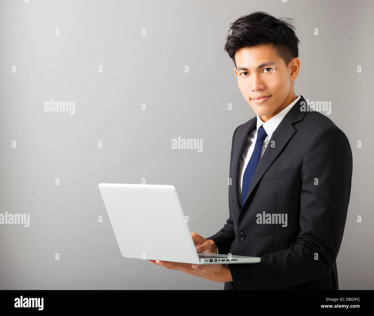 Young asian business man laptop hi-res stock photography and images - Alamy