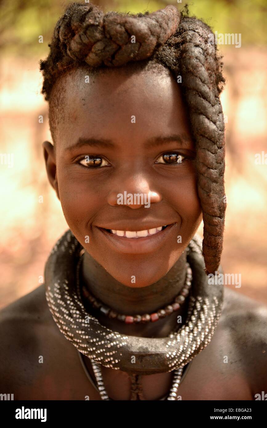 Smiling Himba girl with typical hairstyle, Omuramba, Kaokoland, Kunene ...