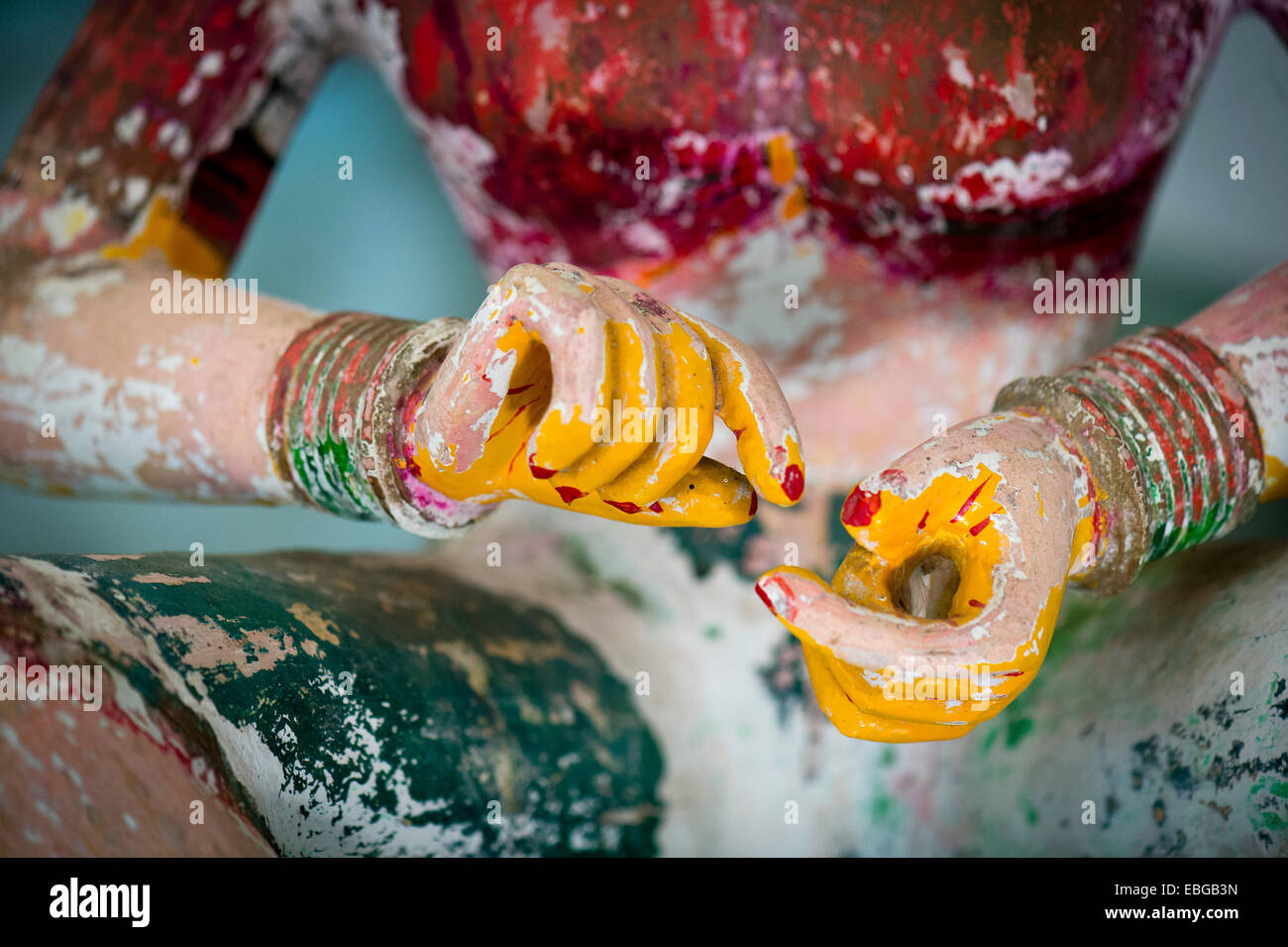 Hands of an old wooden temple figure, Vembanad lake, Kerala, India ...