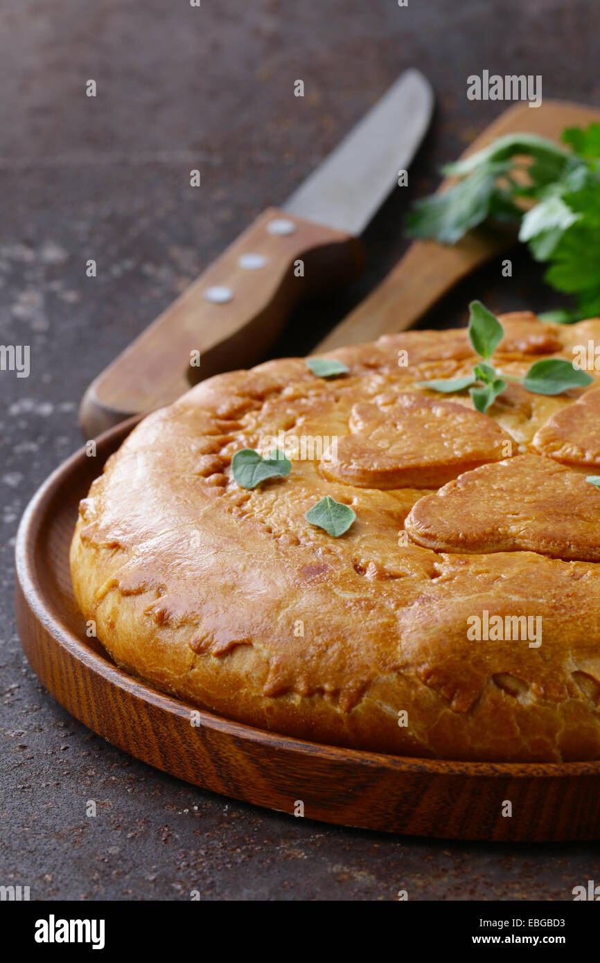 homemade meat pie with potatoes and oregano Stock Photo - Alamy