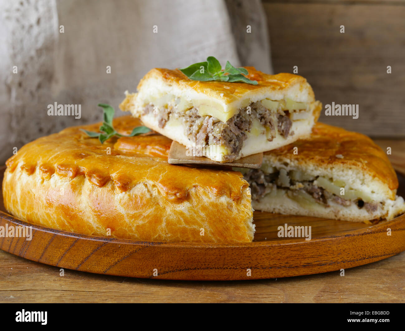 homemade meat pie with potatoes and oregano Stock Photo - Alamy