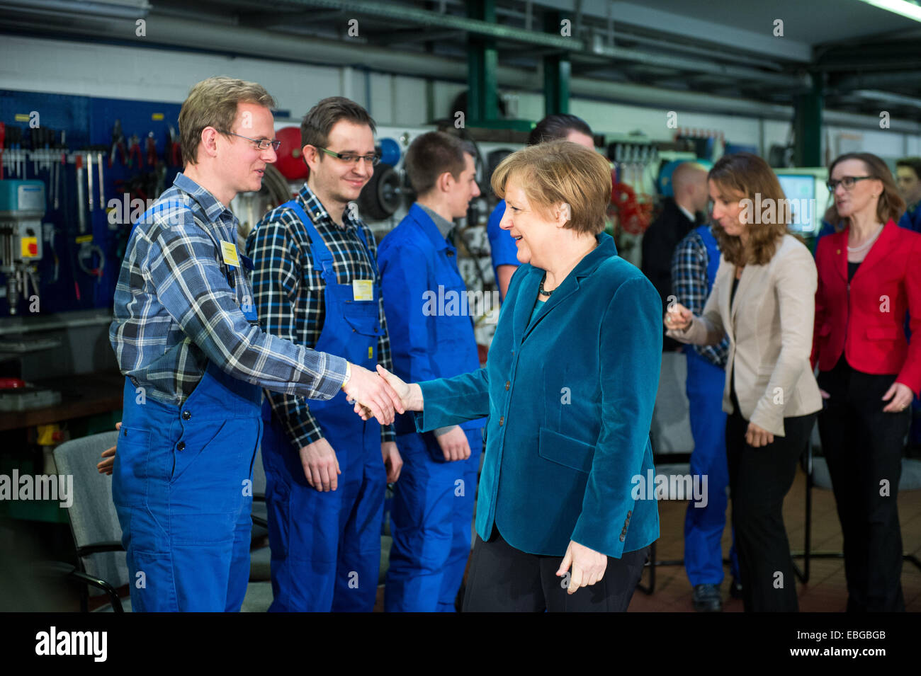 Berlin, Germany. 01st Dec, 2014. Chancellor Angela Merkel greets young ...