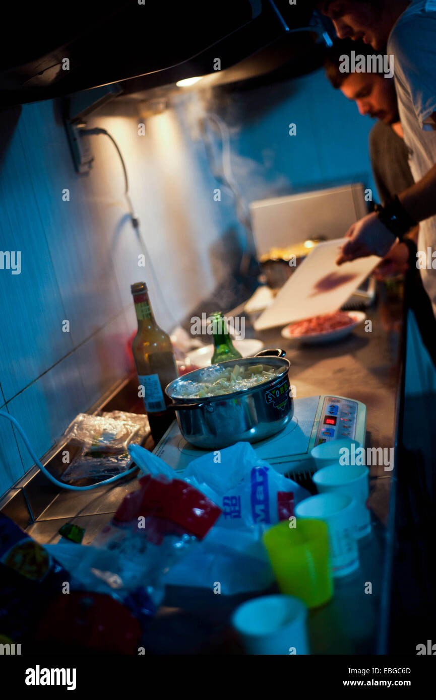 Messy kitchen while cooking pasta Stock Photo - Alamy