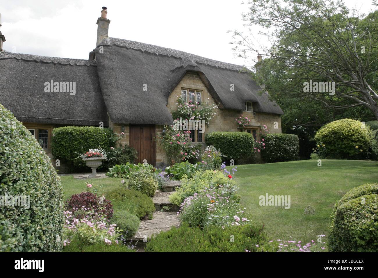 A pretty thatched cottage in the cotswolds with its fine garden at ...
