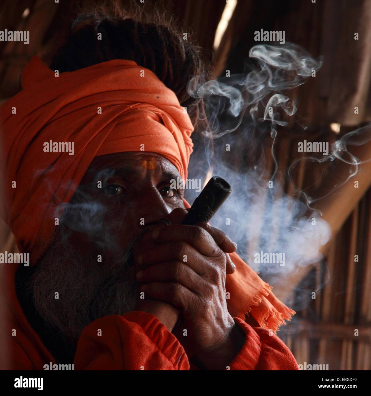 A monk smokes Hashish or Marijuana in Hardoi, wherein smoking kills 1 ...