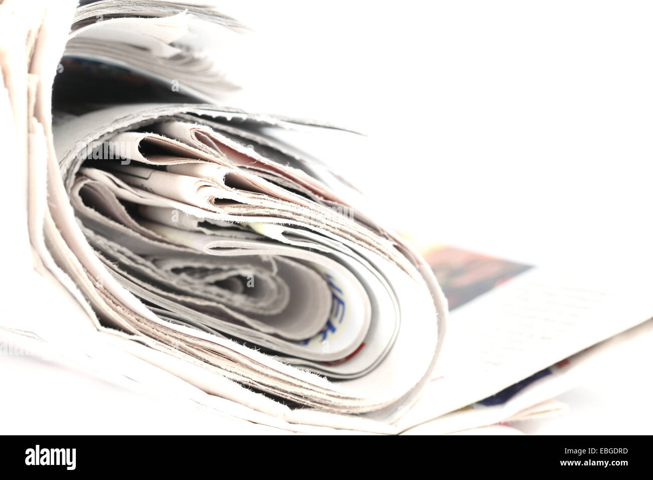 newspaper roll isolated on white background Stock Photo - Alamy